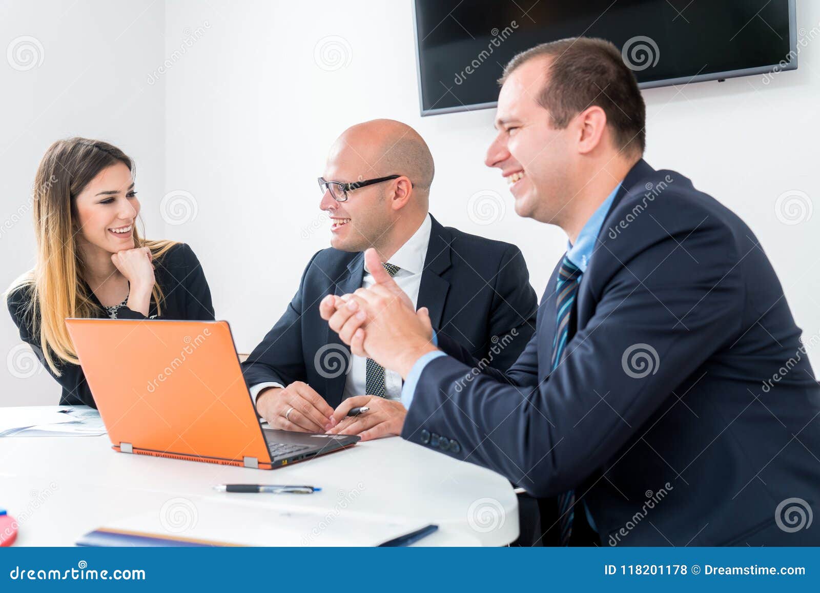 A Business Team of Three Sitting in Office and Planning Work. Us Stock ...