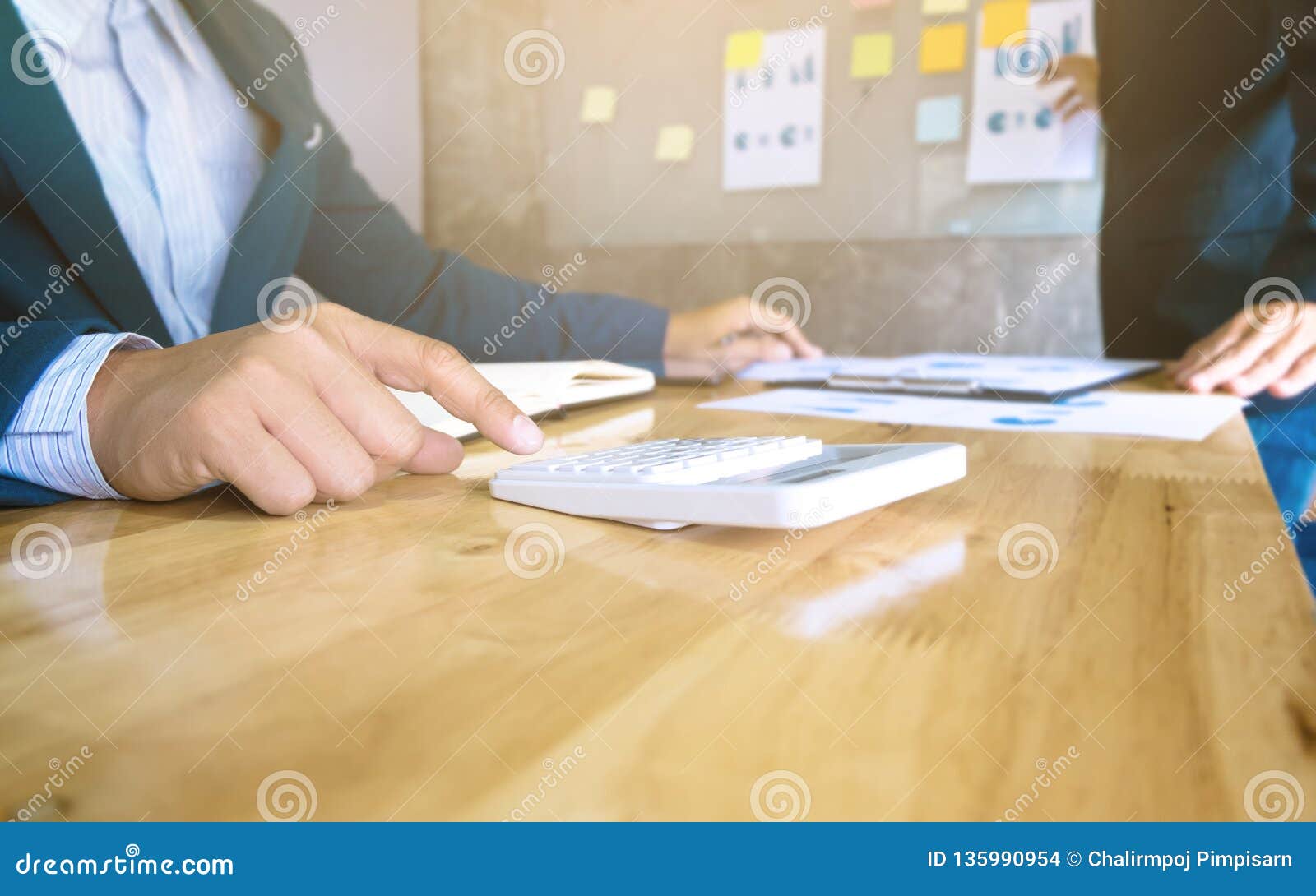 Business Team Using a Calculator Analysis Data Documents and Using ...