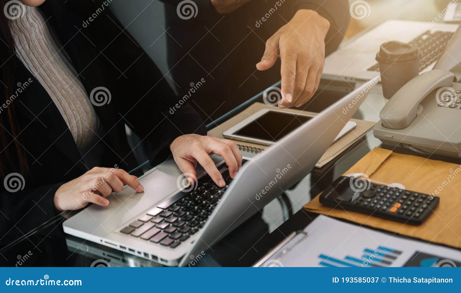 Business Team Using a Calculator To Calculate the Numbers of Statistic ...