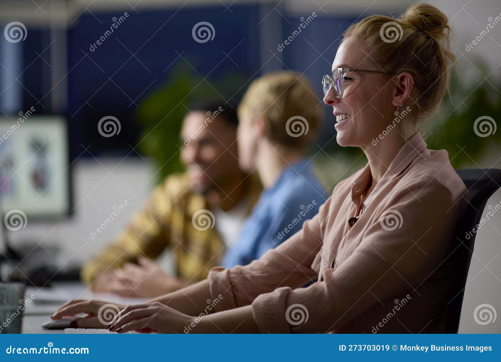 Business Team Using Computers at Desks in Office Working Late Stock ...