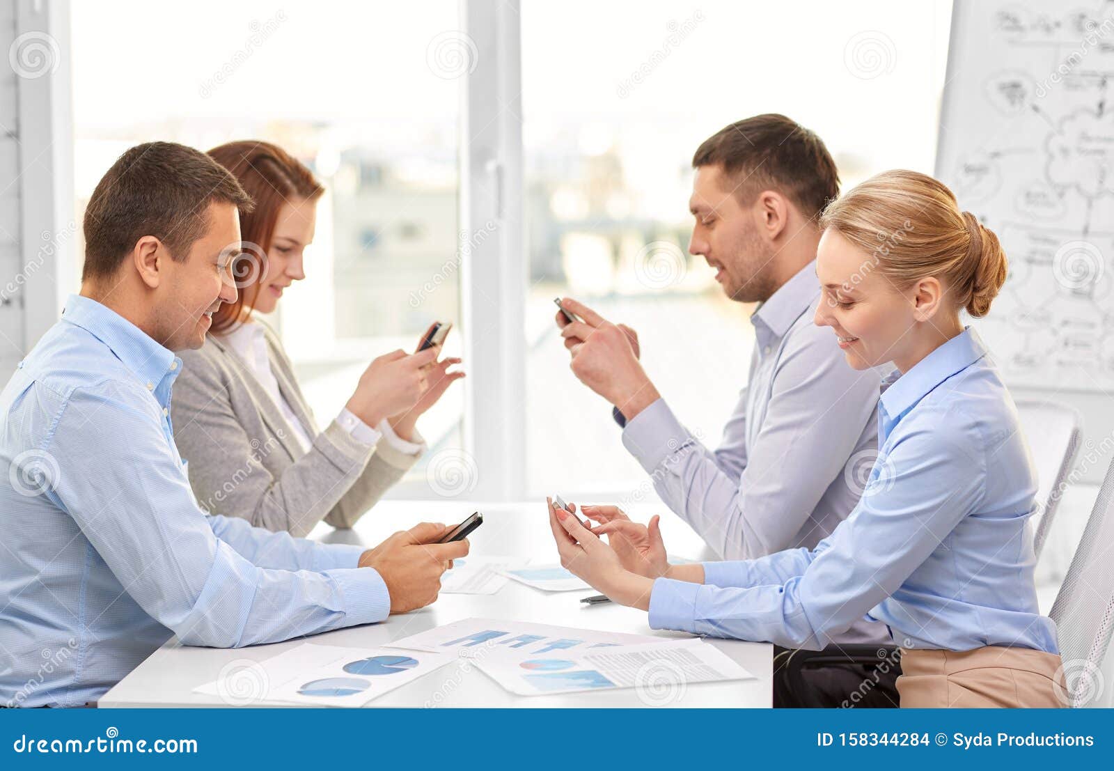 Business Team Using Smartphones at Office Stock Photo - Image of ...