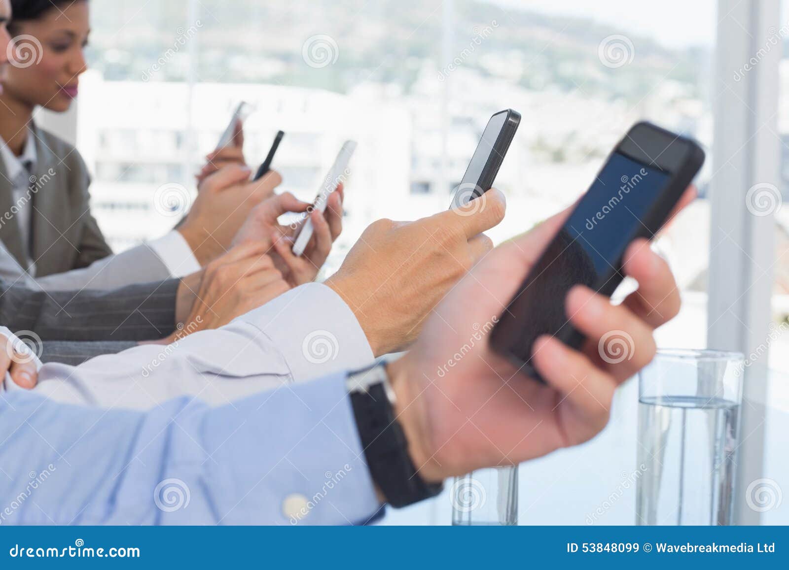 Business Team Using Their Mobile Phone Stock Image - Image of dressed ...