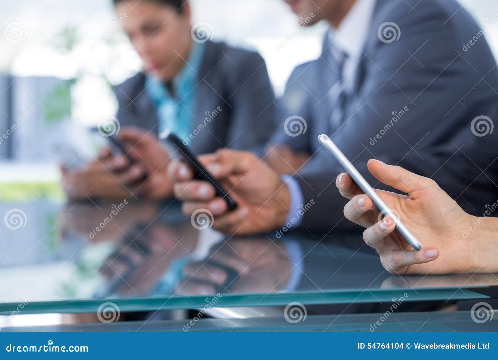 Business Team Using Their Mobile Phone Stock Photo - Image of holding ...