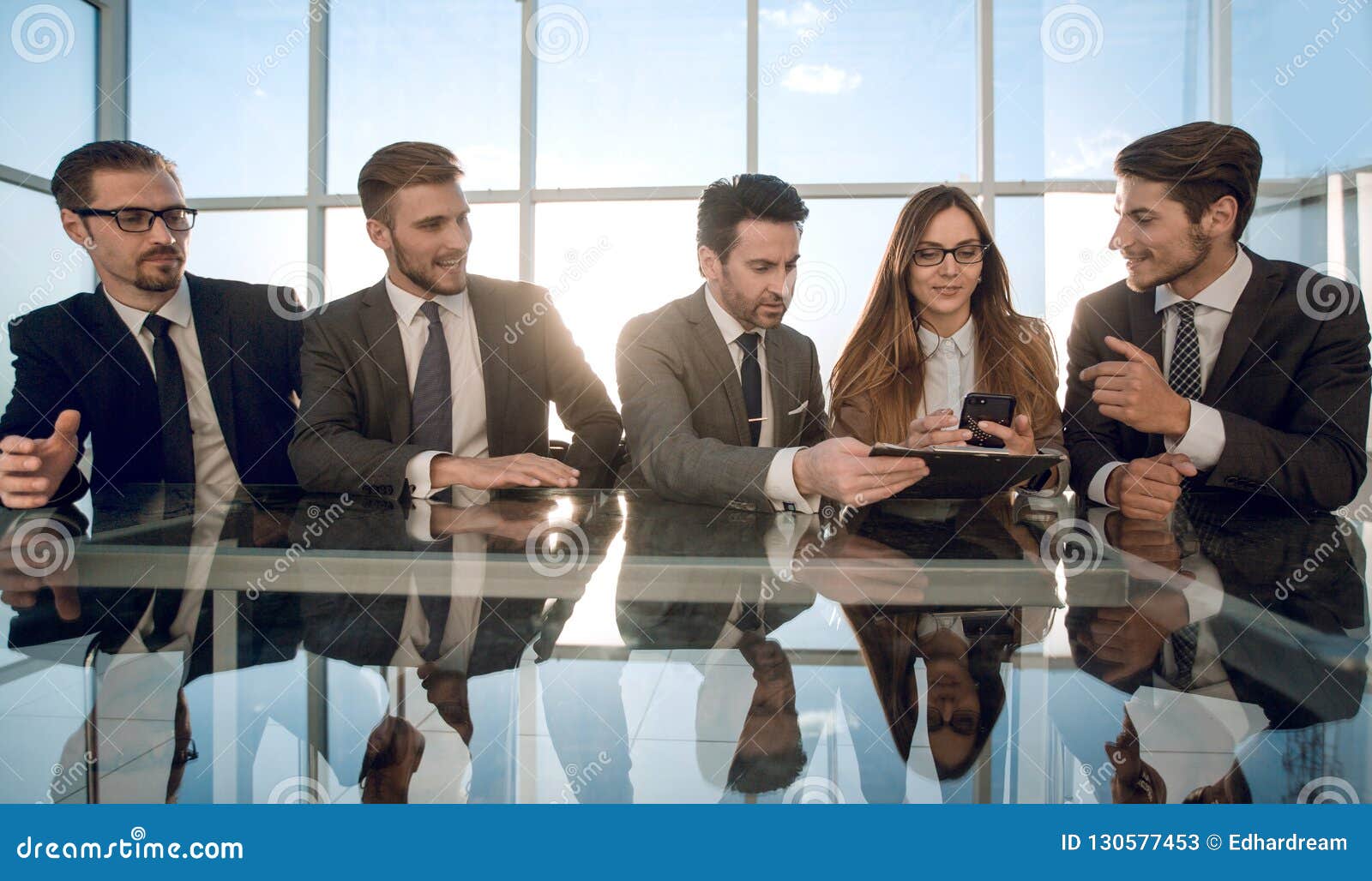 Business Team Using Their Mobile Phone in the Office Stock Image ...