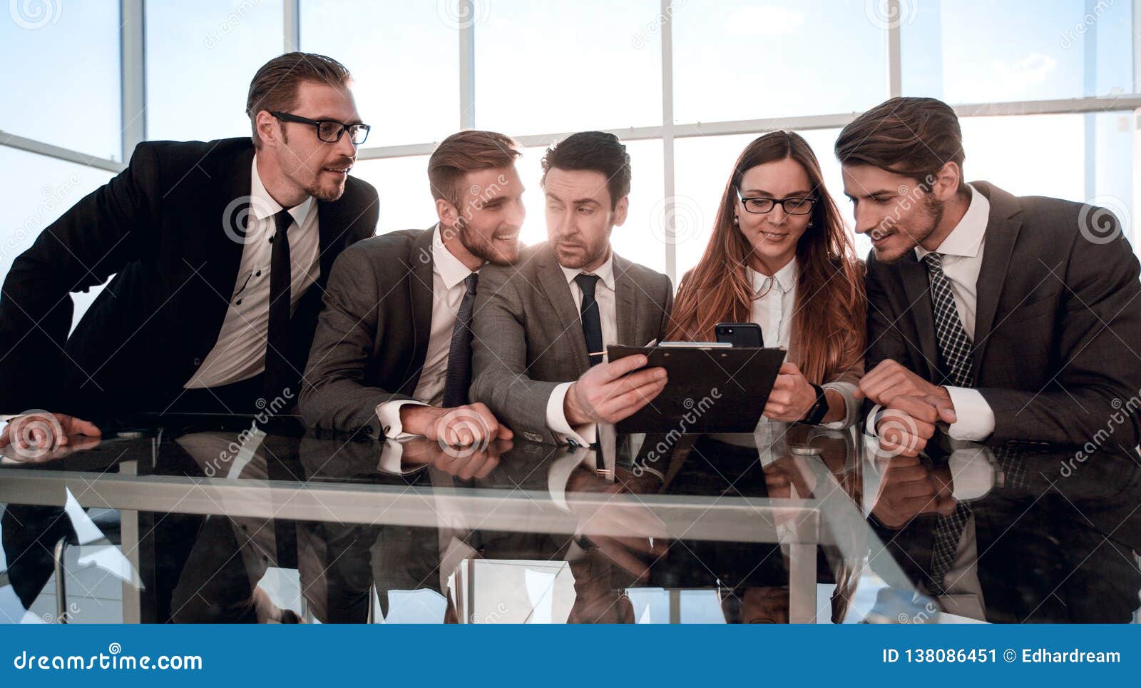 Business Team Using Their Mobile Phone in the Office Stock Image ...