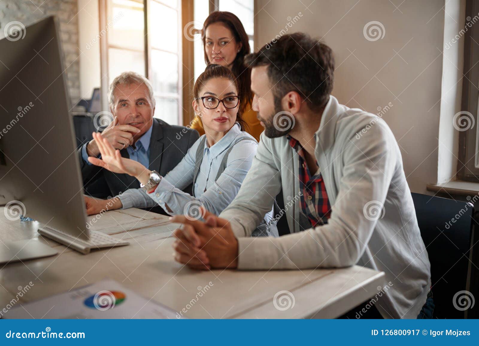 Business Team Workers in Discussion at Computer Stock Image - Image of ...