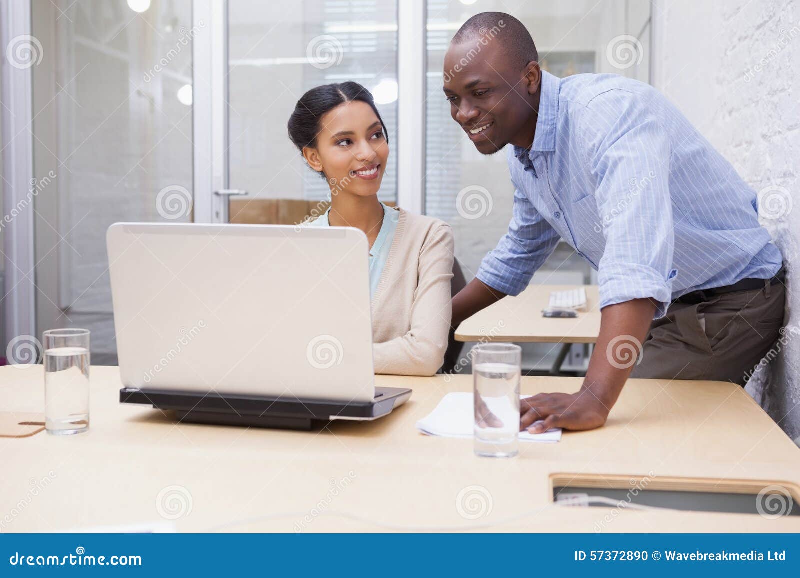 Business Team Working Happily Together on Laptop Stock Photo - Image of ...