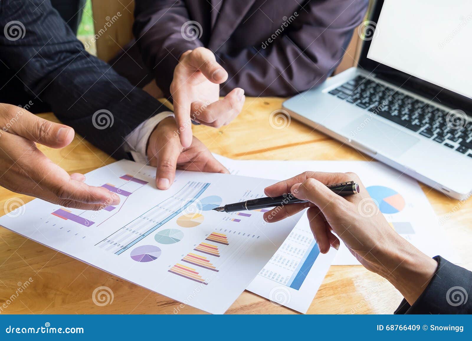 Business Team Working on a New Business Plan with Modern Digital Stock ...