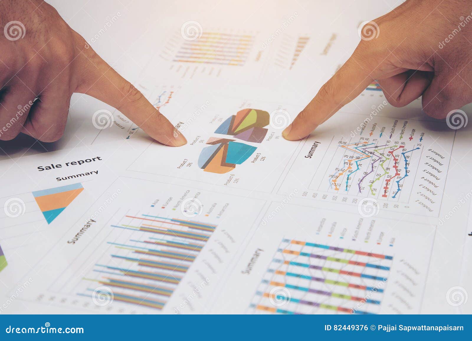 Business Team Working with Reports on Table in Office Stock Photo ...