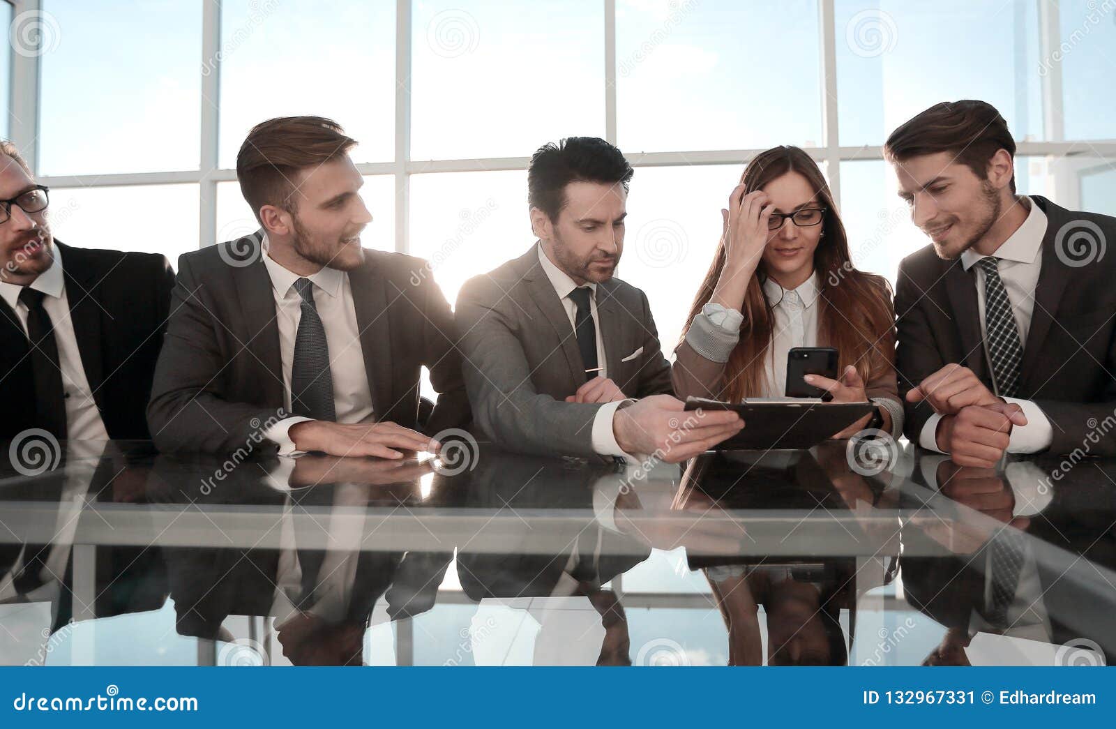 Business Team Using Their Mobile Phone in the Office Stock Image ...