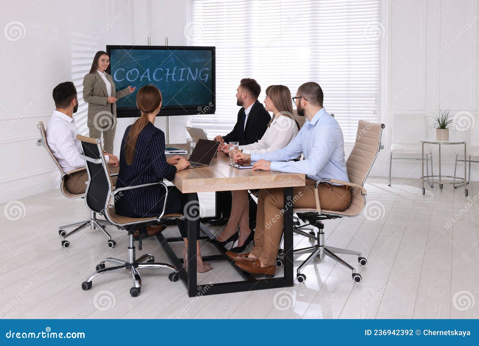 Business Trainer Using Interactive Board in Meeting Room during ...
