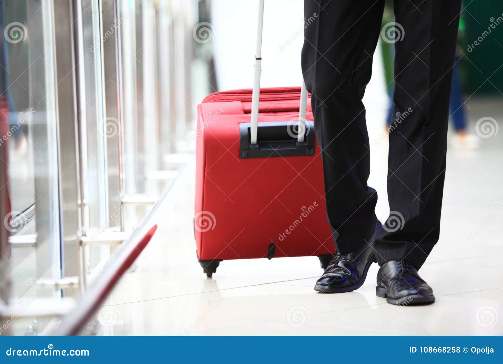 Close-up of Businessman Carrying Suitcase while Walking through a ... Close-up of Businessman Carrying Suitcase while Walking through a ...