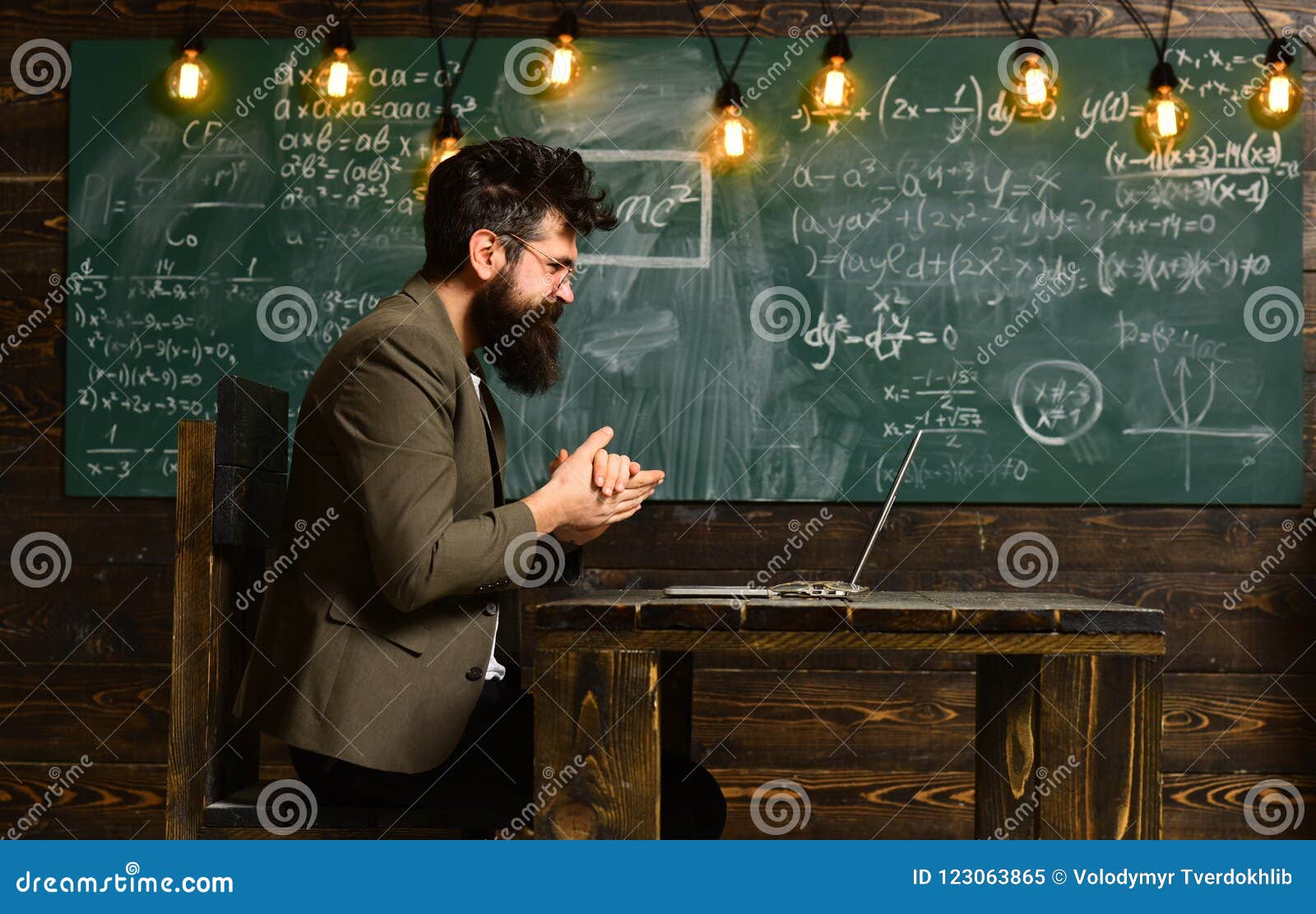 Business Tutor Typing on Laptop at Workplace in Classroom, Teacher Puts ...