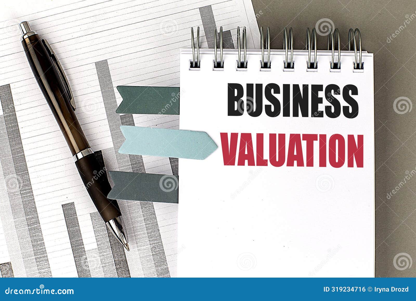 BUSINESS VALUATION Text on Notebook with Chart on Gray Background Stock ...