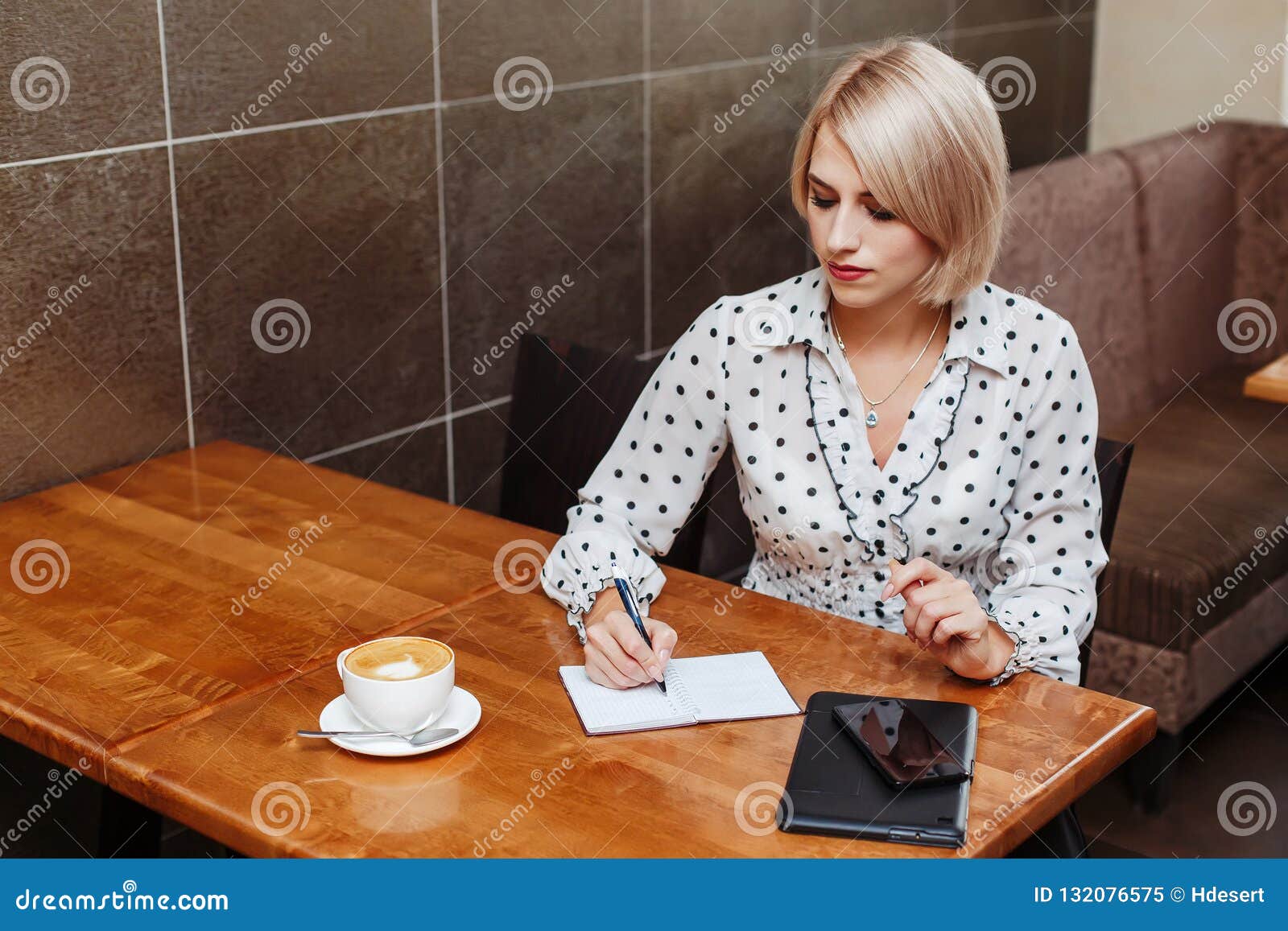 Woman in Cafe Sitting and Writing in Notebook Stock Image - Image of ...