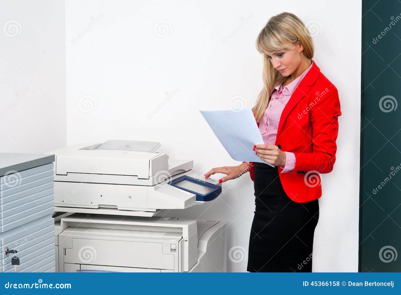 Business Woman with Documents Standing Next To Printer Stock Photo ...