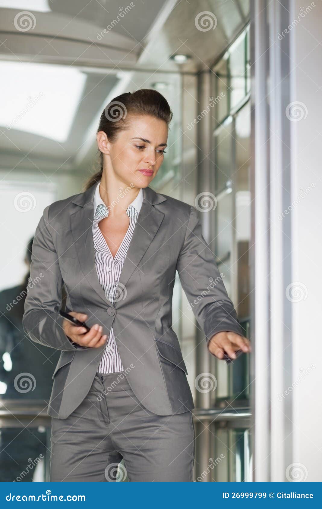Business Woman in Elevator Pushing Button Stock Image - Image of ...