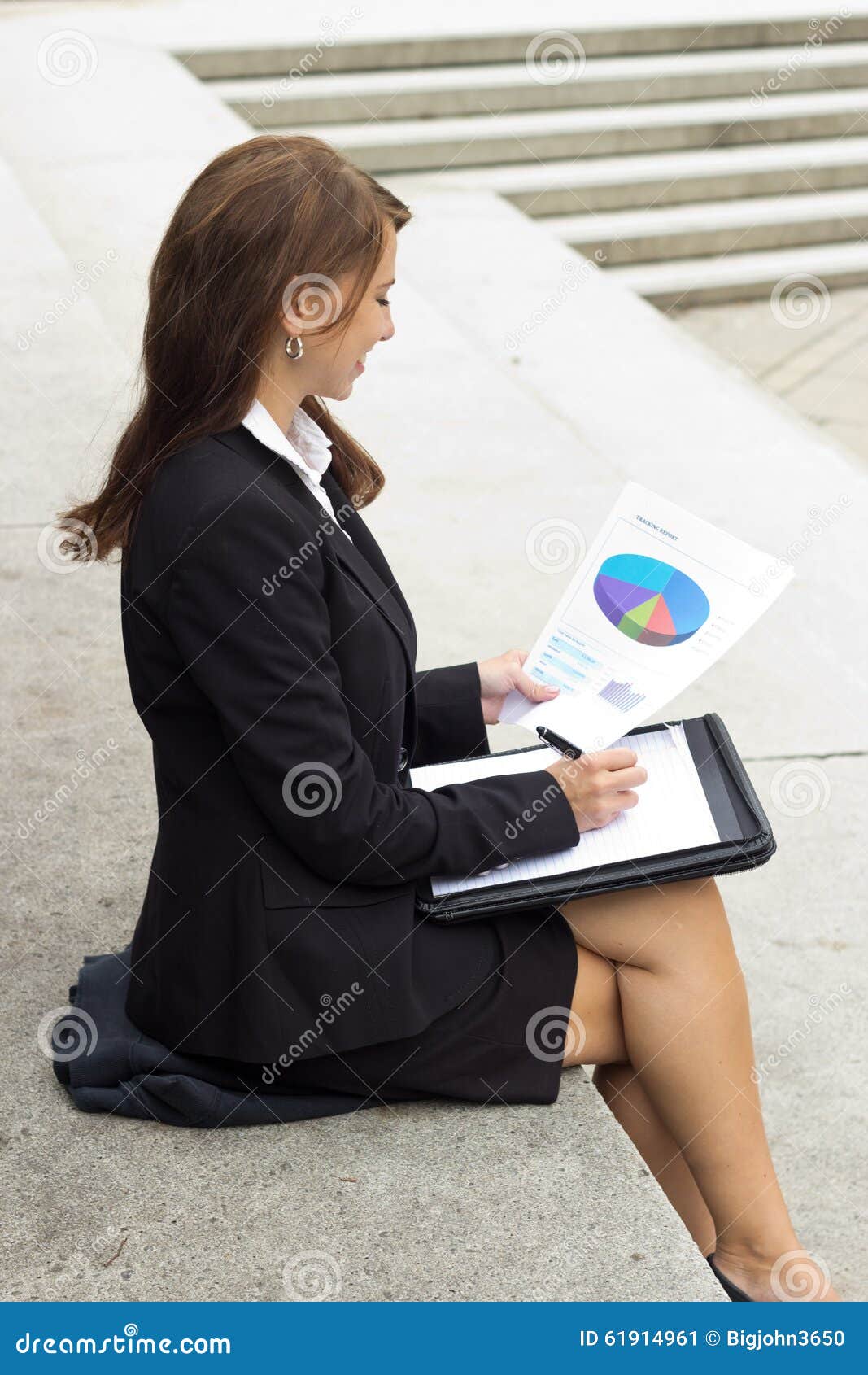 Business Woman Examines Report Document and Writes in Notebook Stock ...