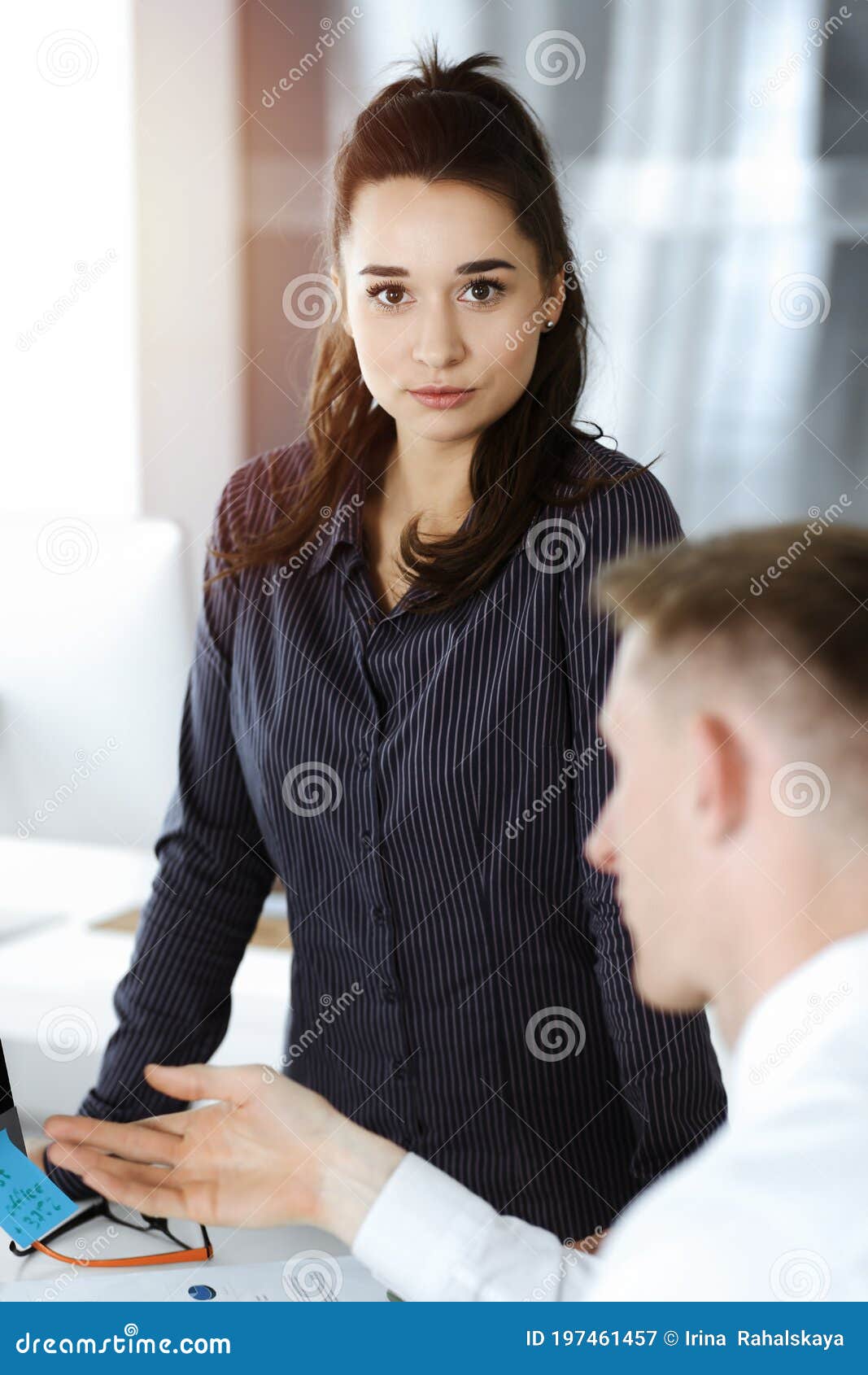 Business Woman and Man Discussing Questions while Using Computer at ...