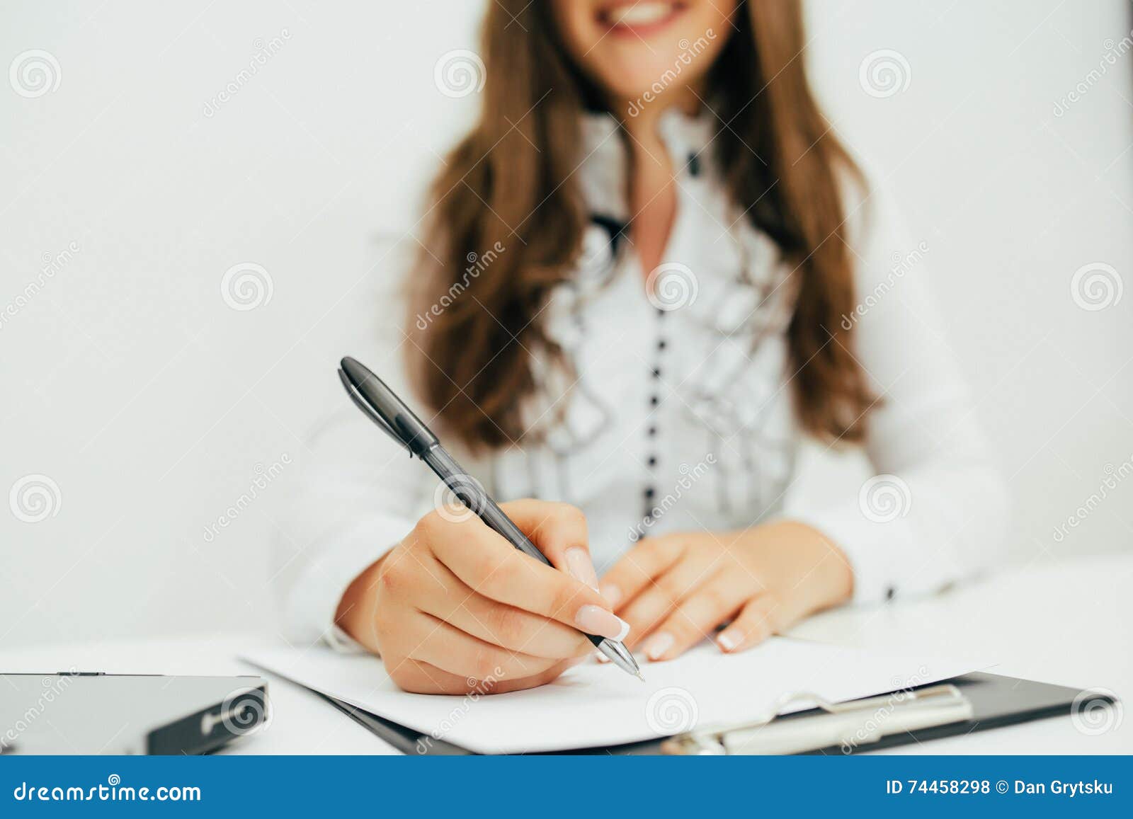 Business Woman with Notebook in the Office and Writing Dates on ...