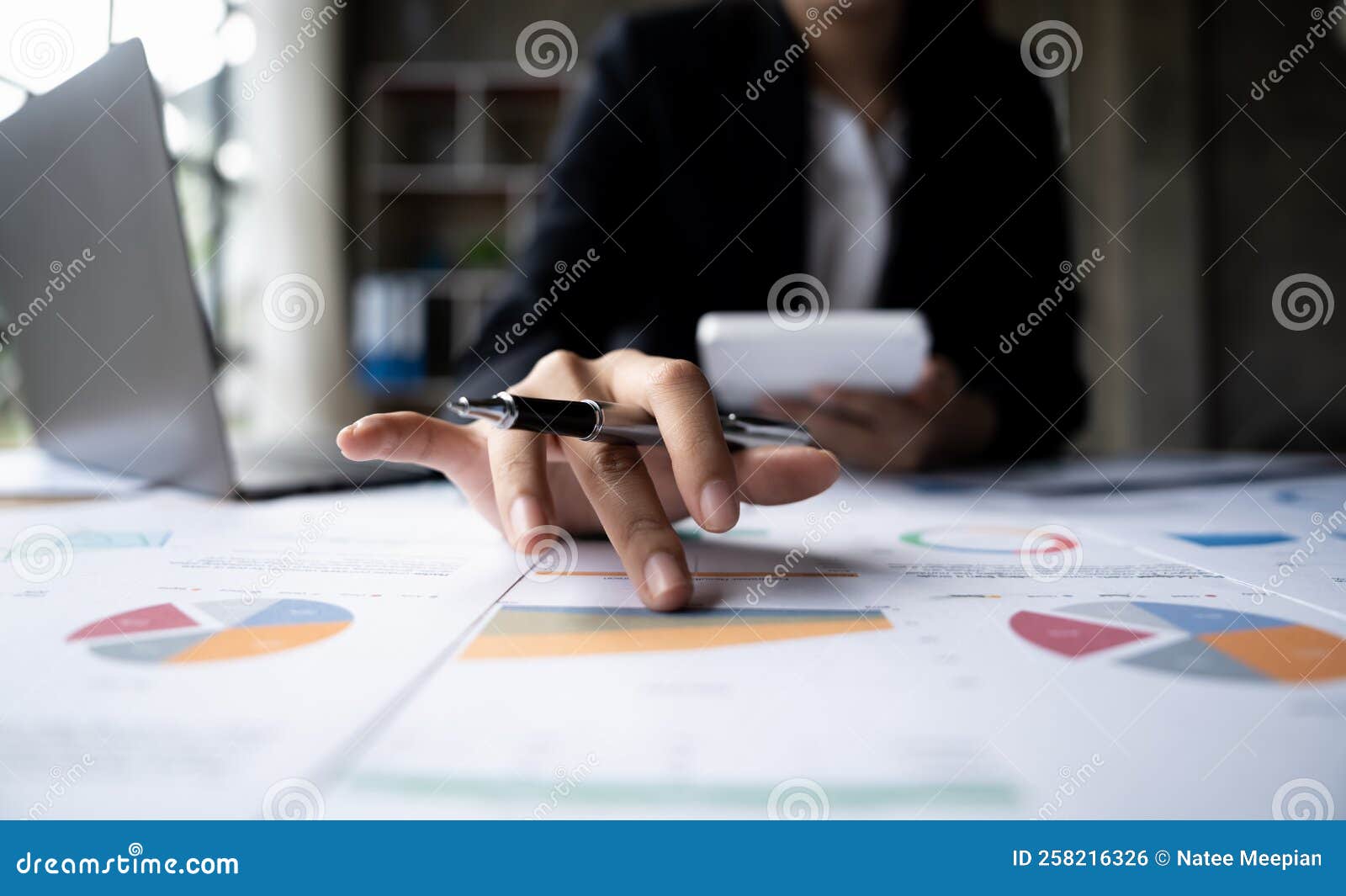 Business Woman Pointing Turnover with Graph Chart Report and Use ...