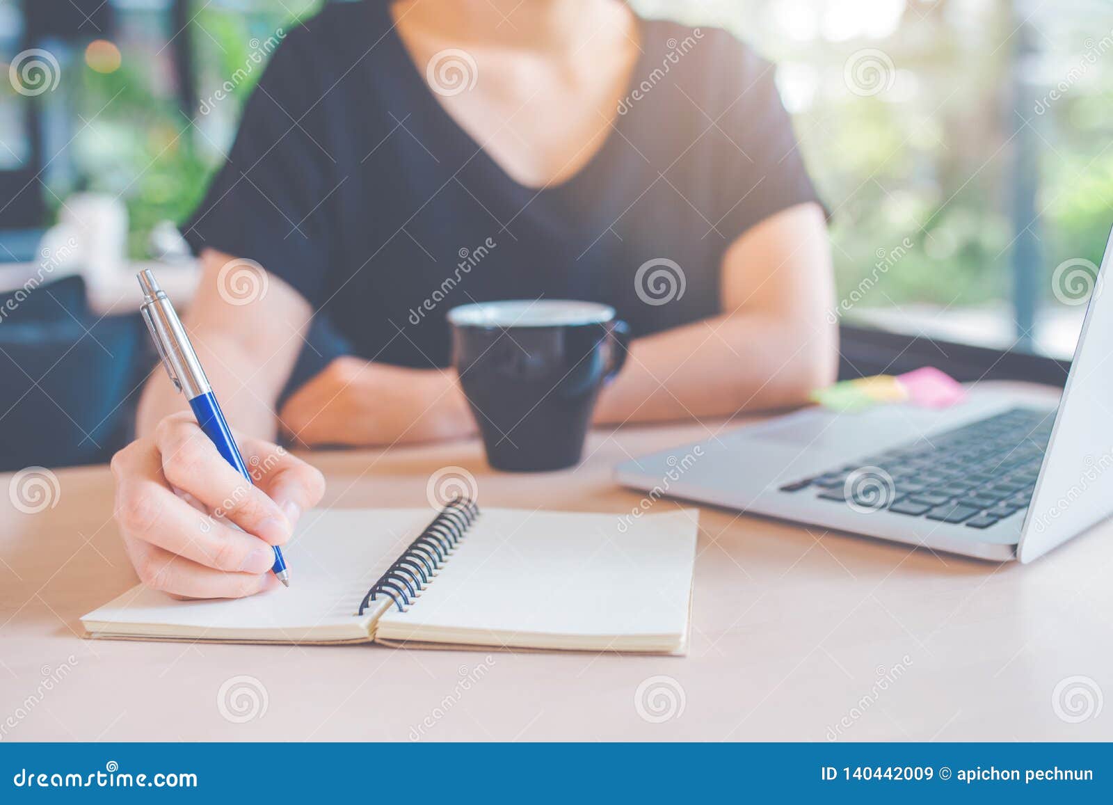 Business Woman`s Hand is Writing on a Notebook with a Pen Stock Image ...