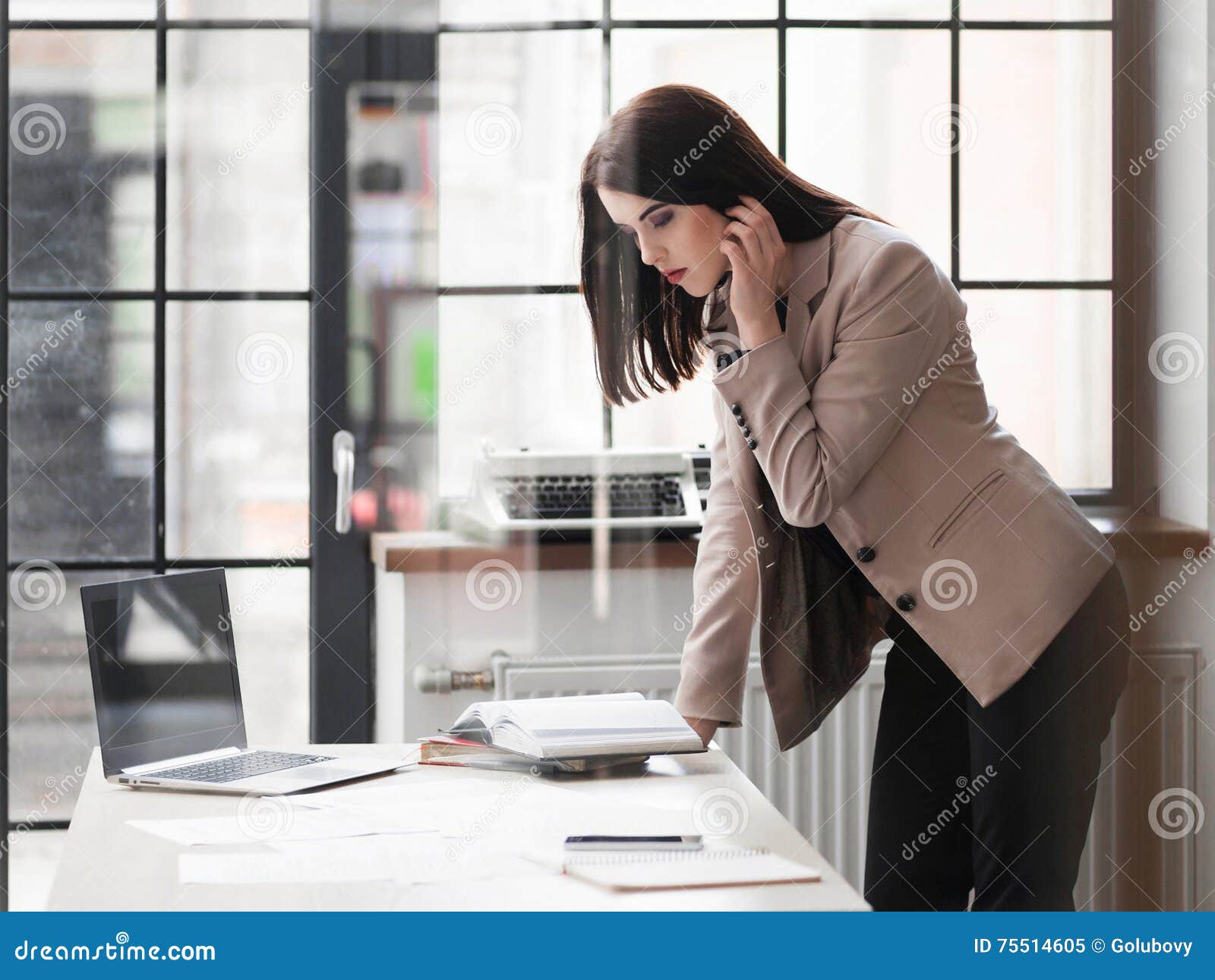 Business Woman Standing Leaning On Desk In Office Stock Image Image
