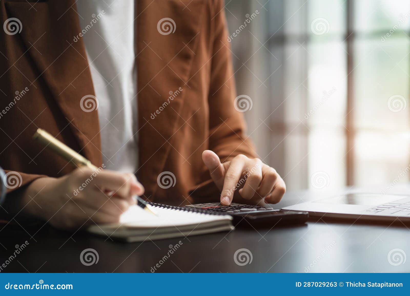 Business Woman Take Notes and Use the Calculator with Calculations ...