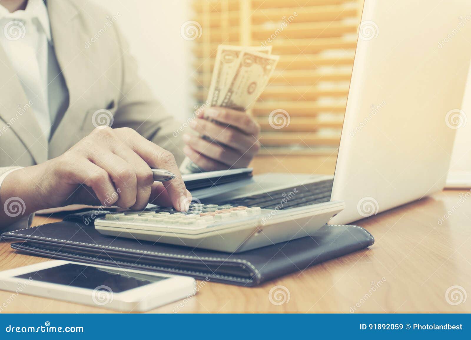 Business Woman Using Calculator Counting Money and Making Notes Stock ...