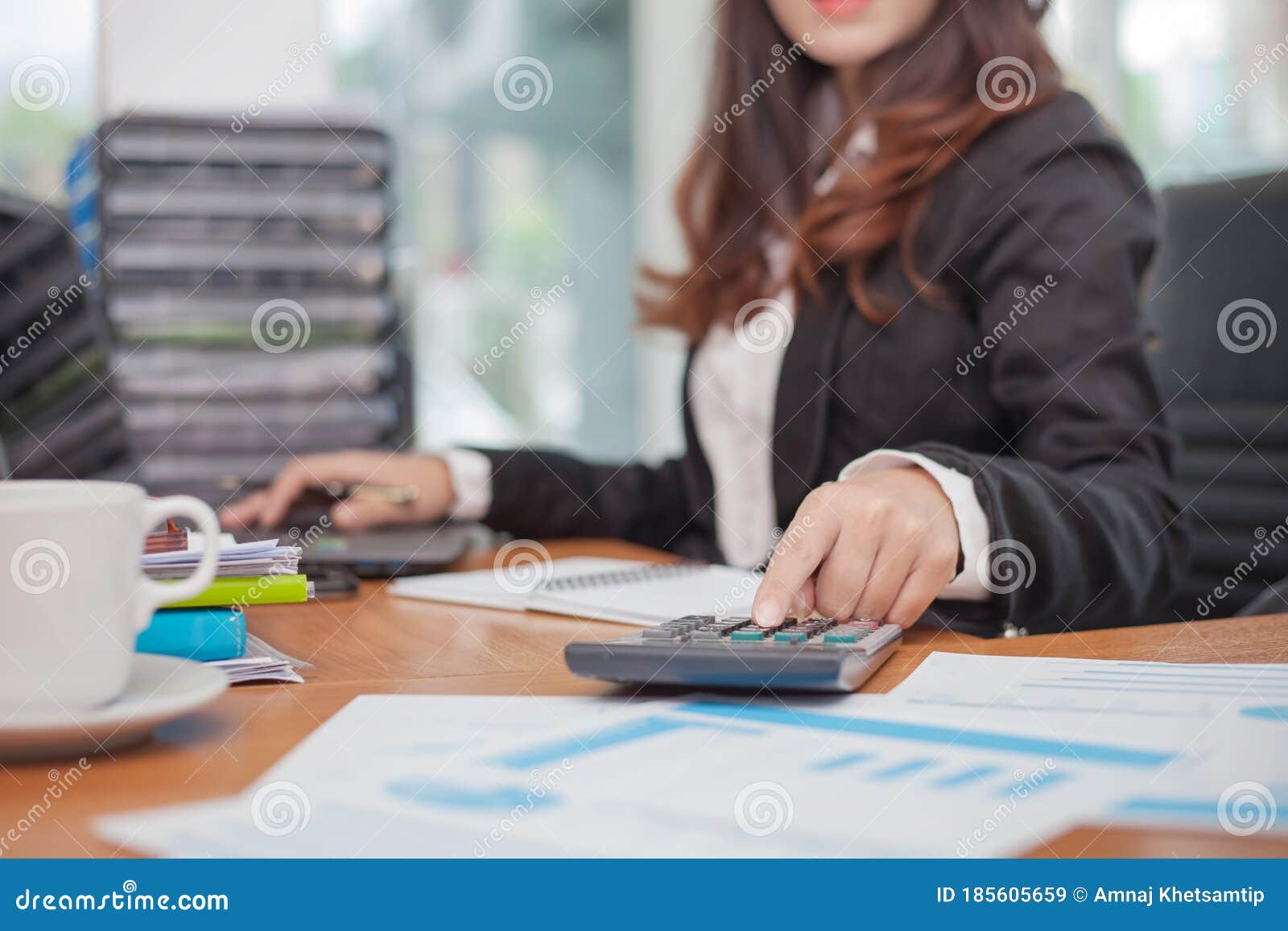 Business Woman Using Calculator and Writing Make Note with Calculate ...