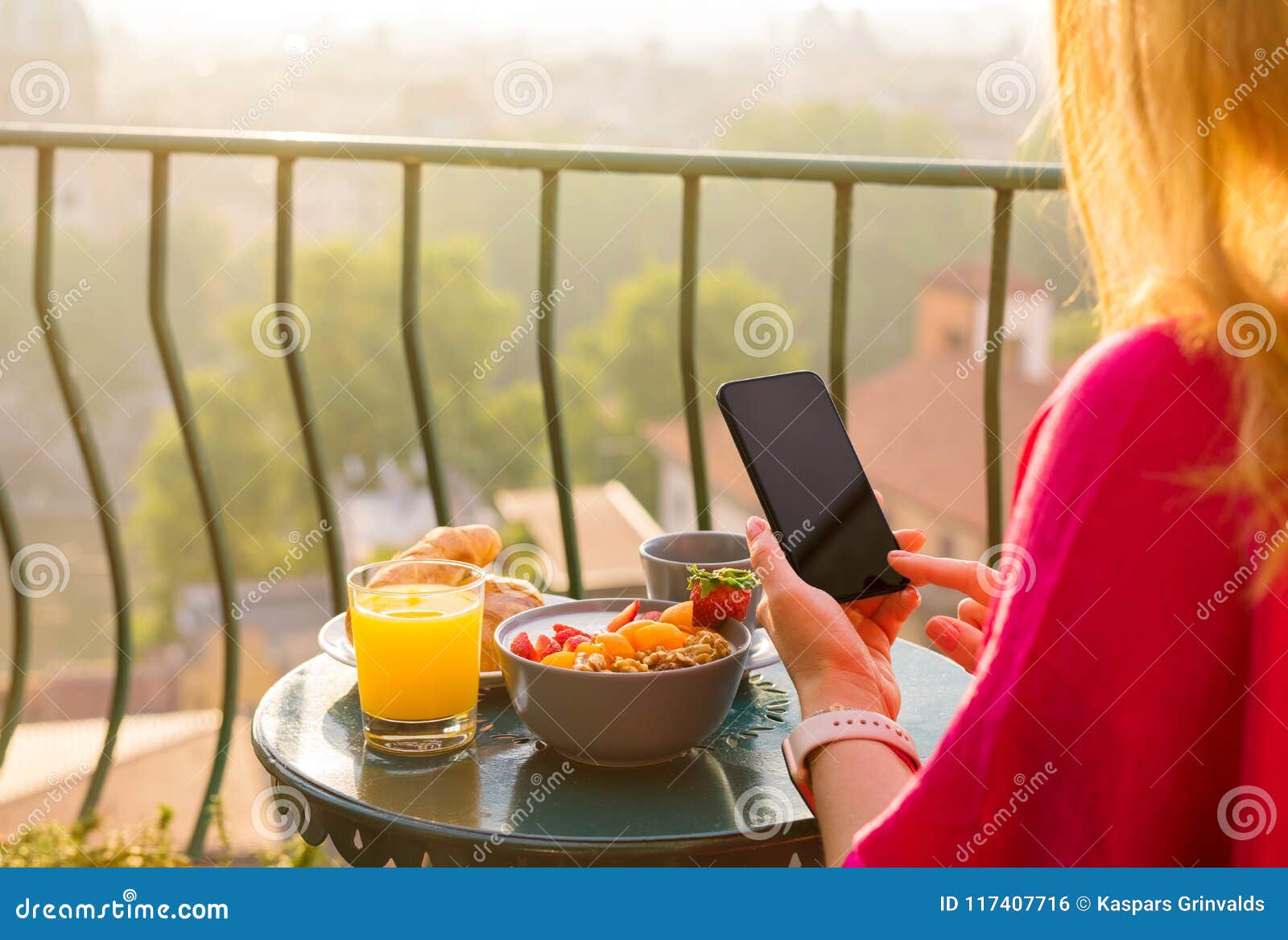 Woman Using Phone at Breakfast on Balcony Stock Photo - Image of iphone ...