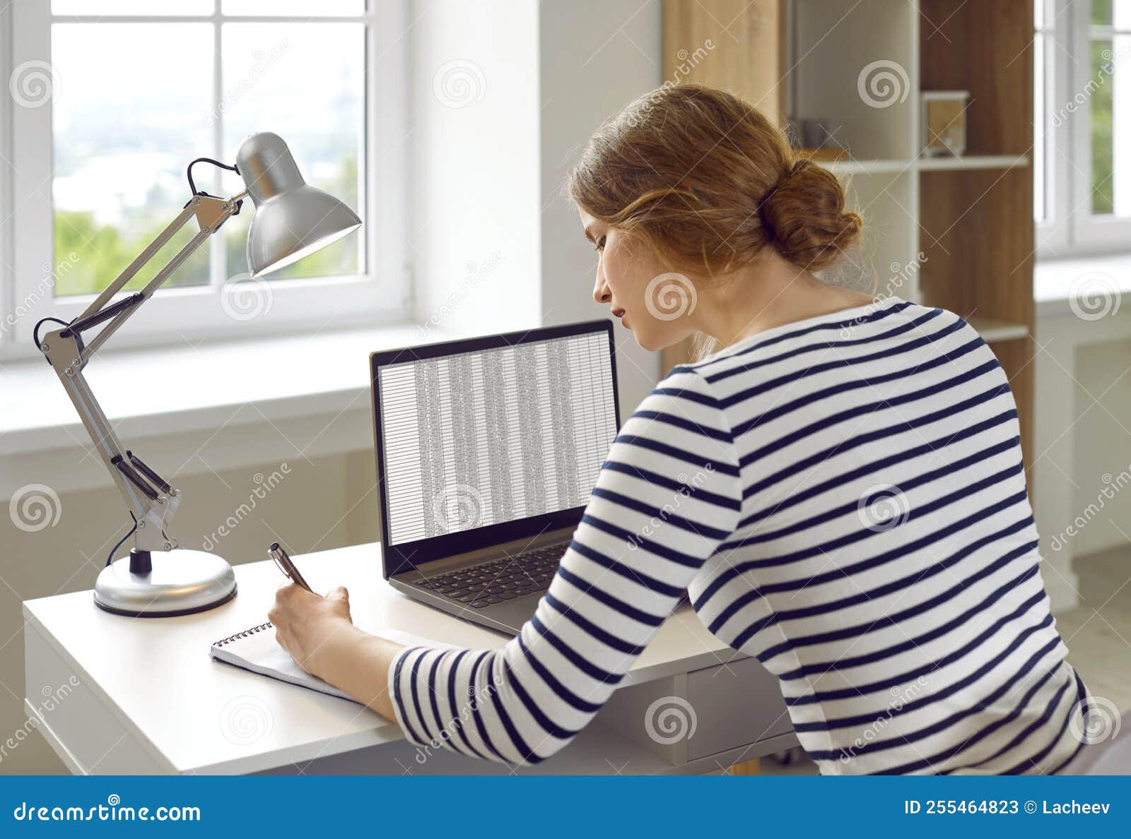 Business Woman Working in Office, Using Spreadsheets and Taking Notes ...