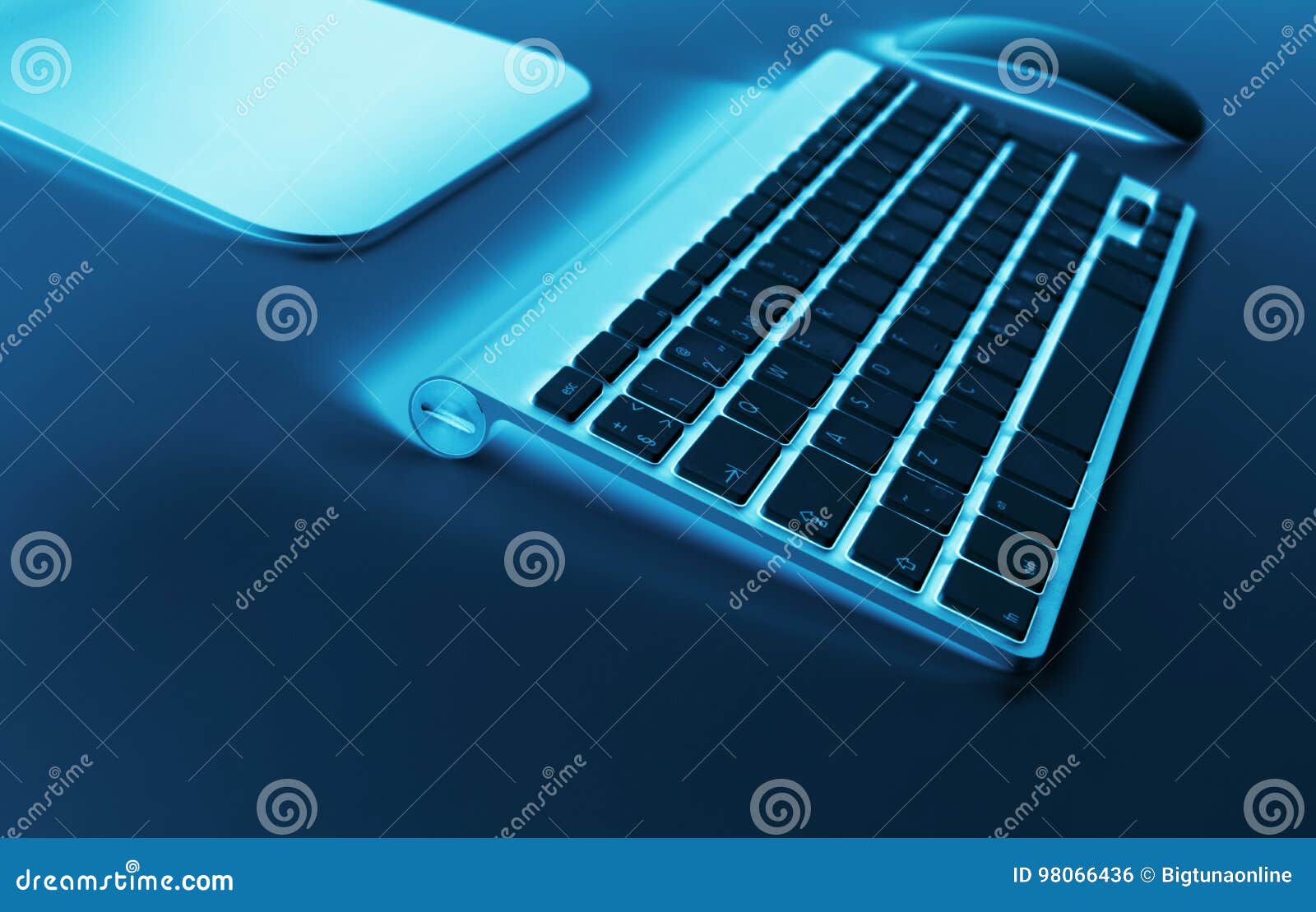 Business Workplace with Computer Wireless Keyboard and Mouse on Blue ...