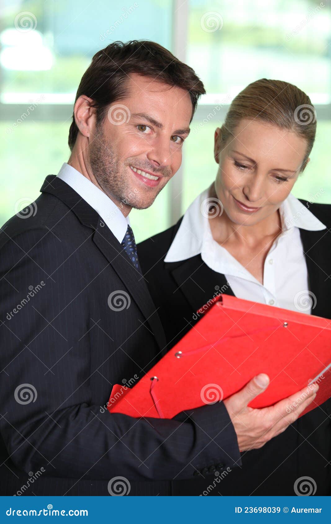 Businesscouple Looking at Notes Stock Image - Image of front, office ...