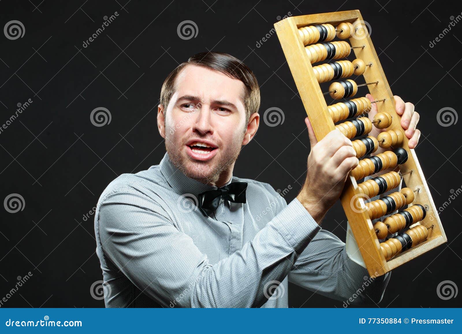 Businessman with abacus stock photo. Image of aggravated - 77350884