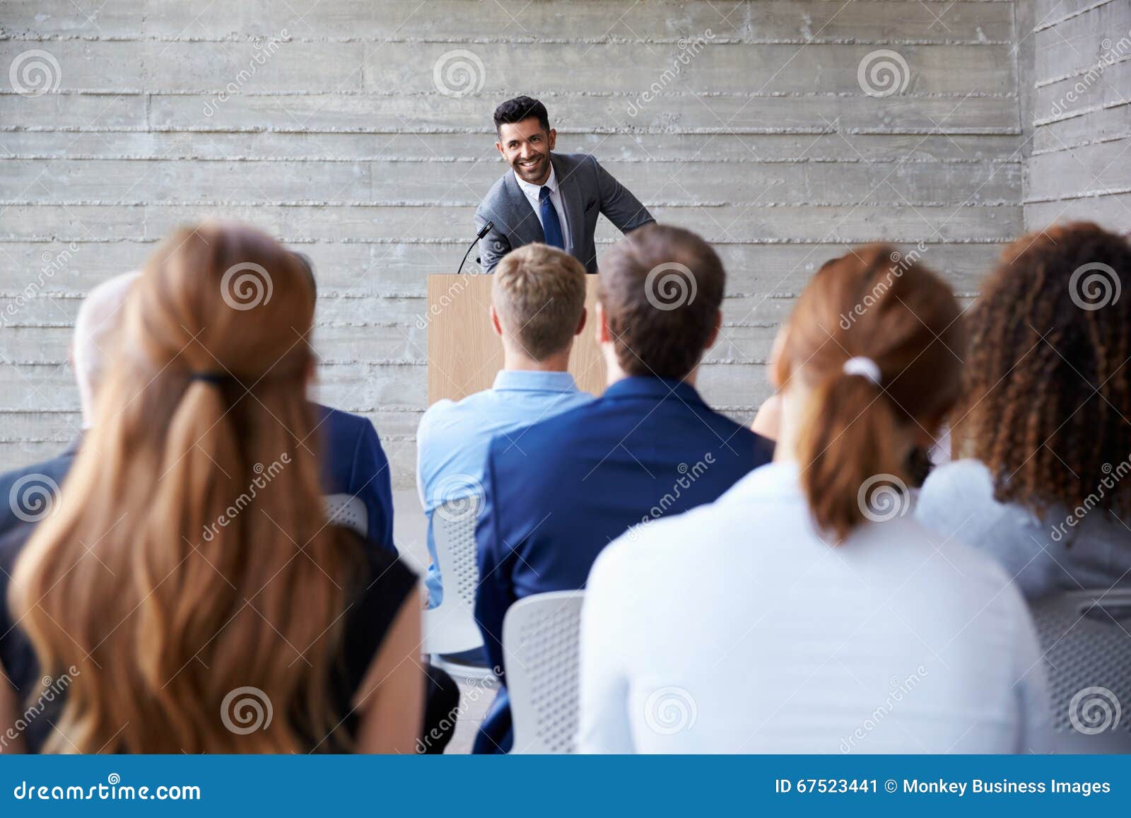 Businessman Addressing Delegates at Conference Stock Image - Image of ...