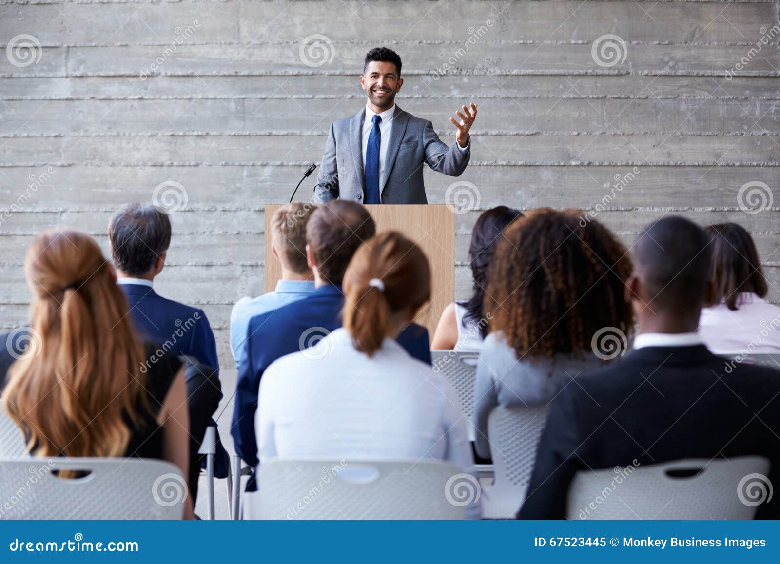 Businessman Addressing Delegates at Conference Stock Image - Image of ...