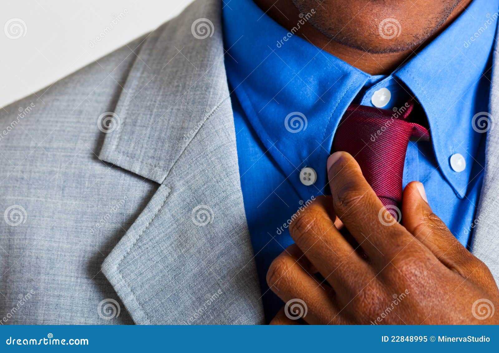 Businessman Adjusting Collar Stock Image - Image of loosen, african ...
