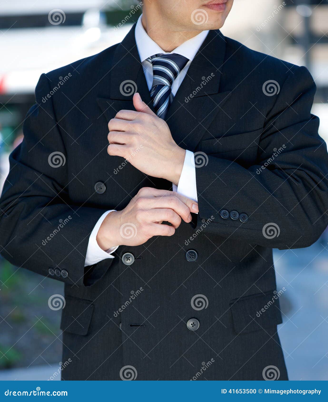 Businessman adjusting cuff stock photo. Image of holding - 41653500