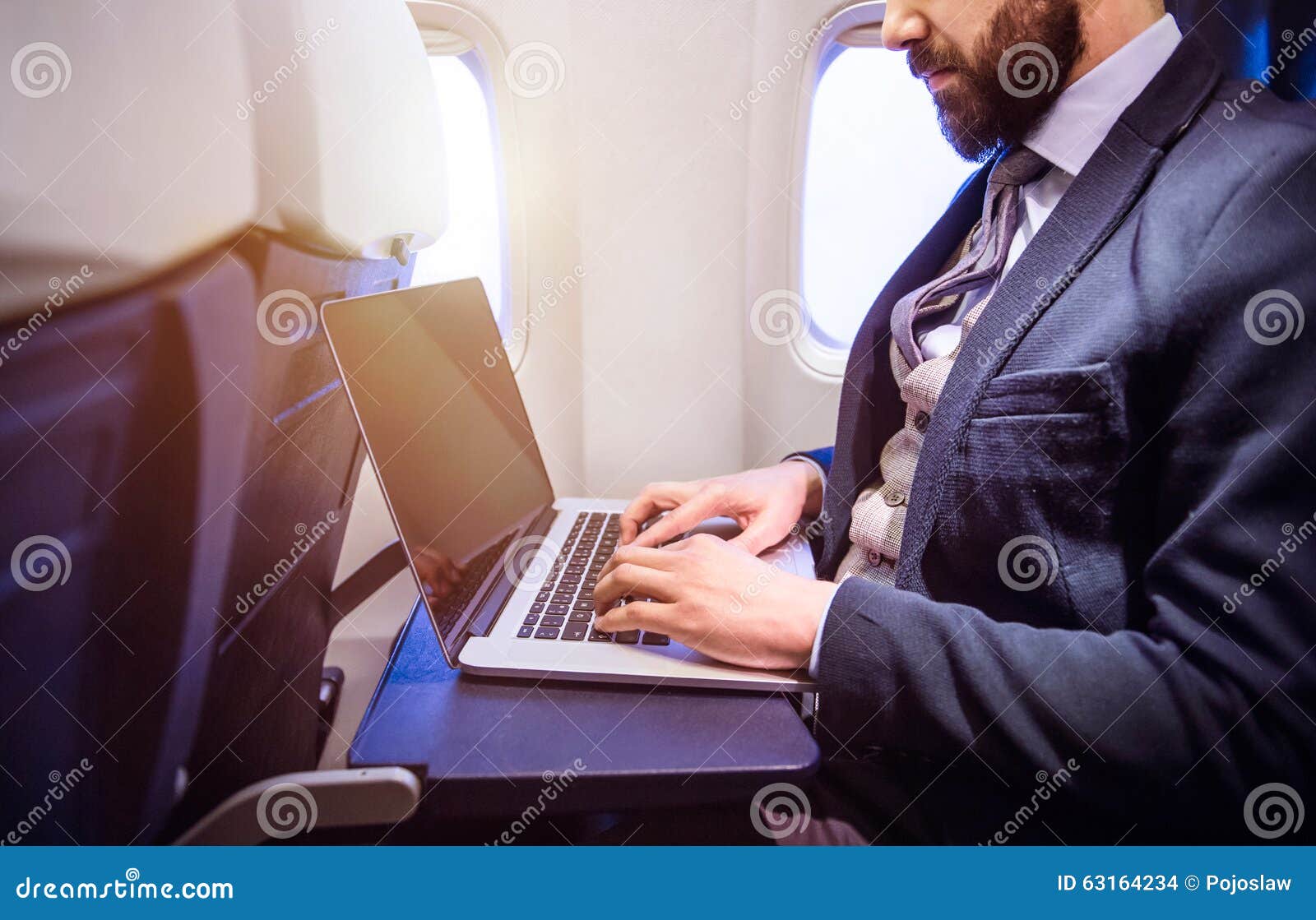 Businessman in airplane stock photo. Image of journey - 63164234