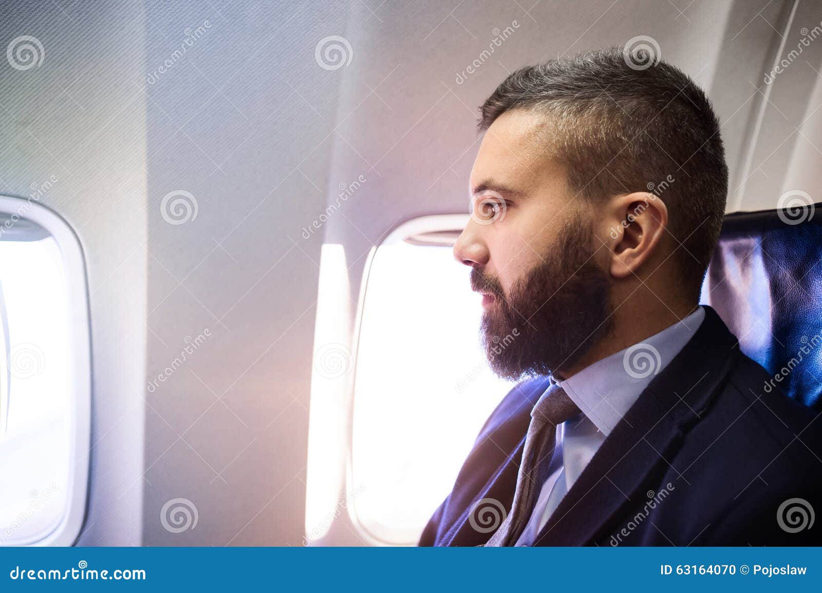 Businessman in airplane stock photo. Image of lifestyle - 63164070