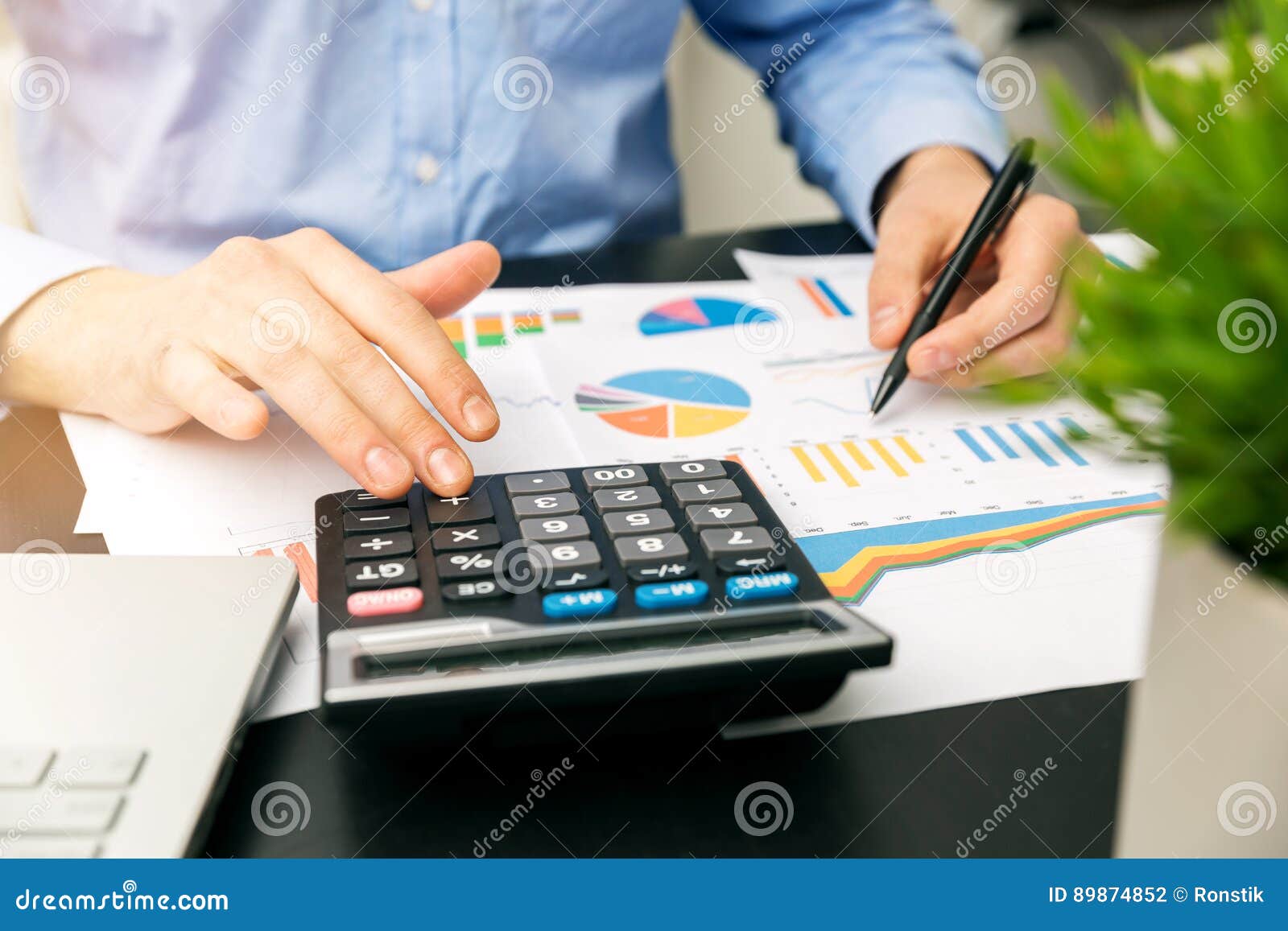 Businessman Analyzing Financial Graphs and Reports Stock Photo - Image ...