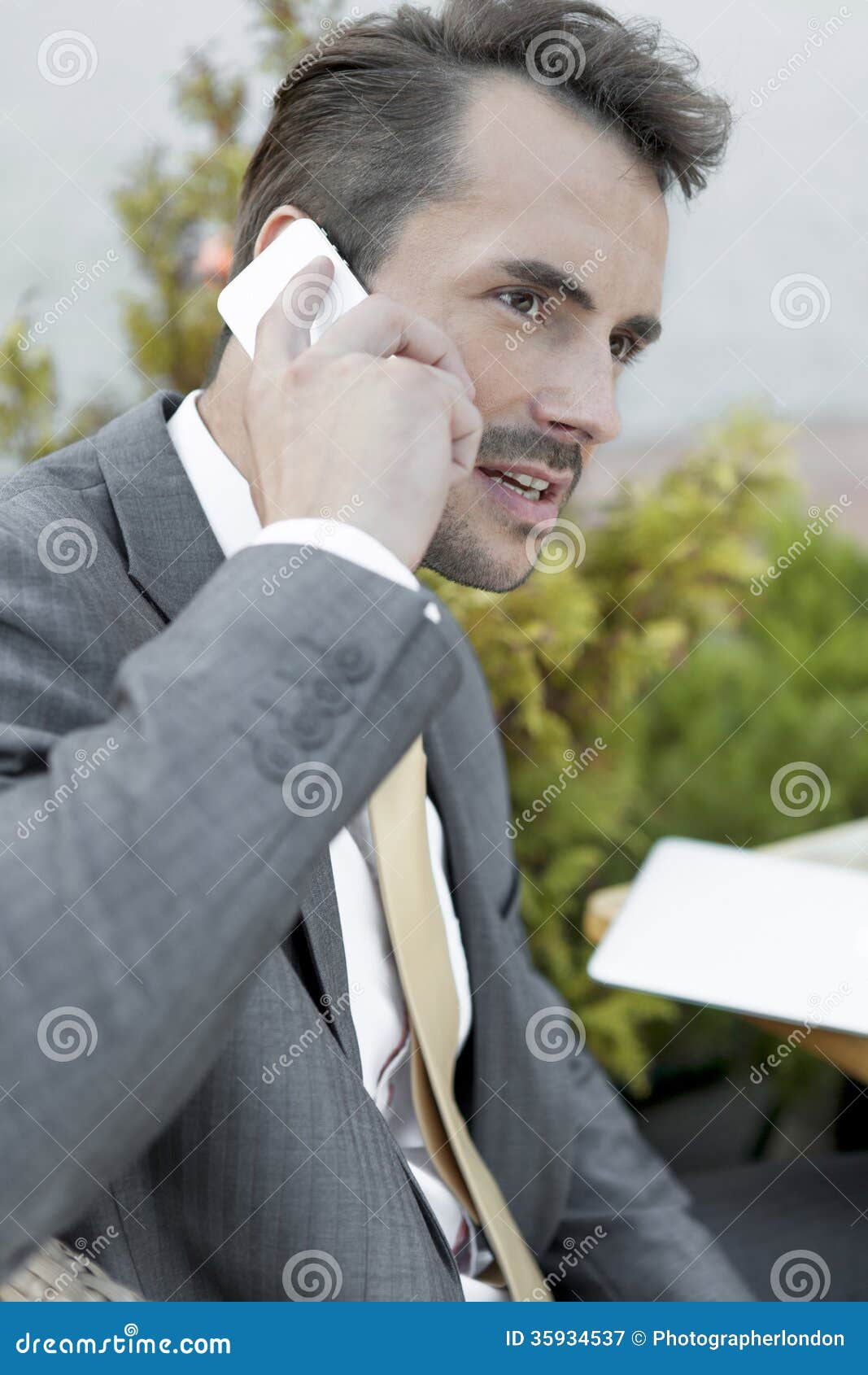Businessman Answering Cell Phone Outdoors Stock Image - Image of ...