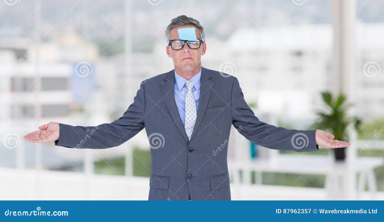 Businessman with Arms Stretched and Sticky Note Stuck on Forehead Stock ...