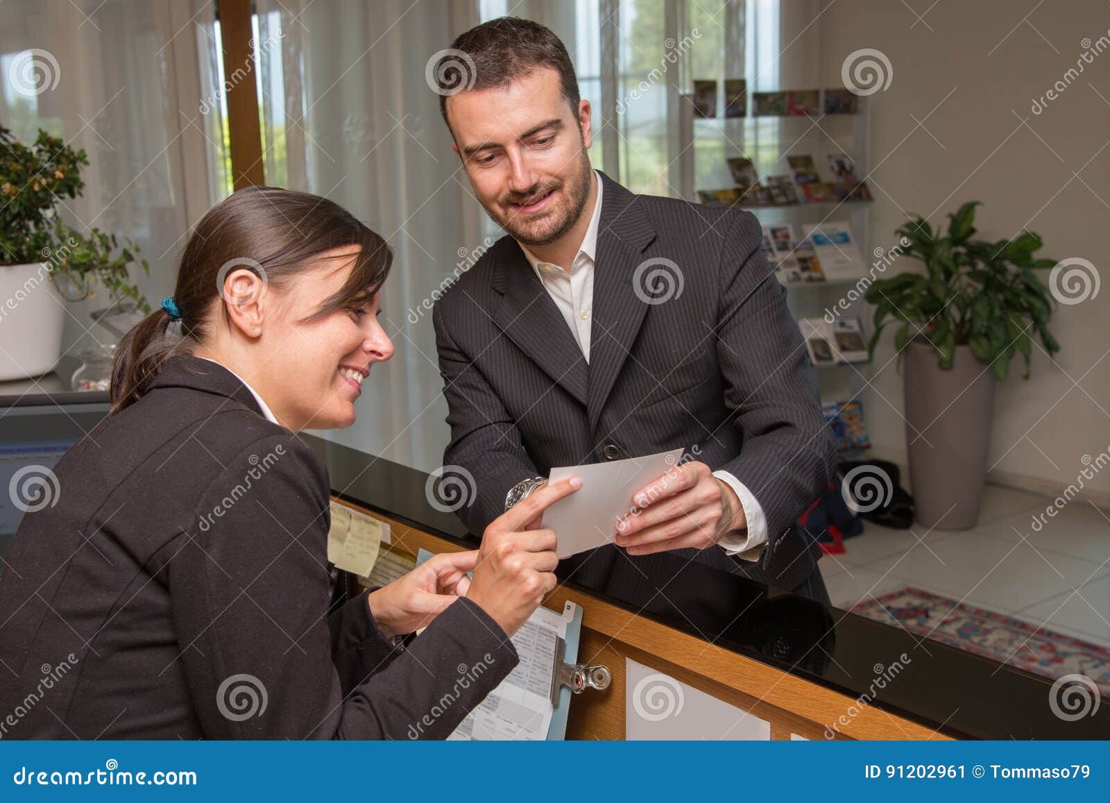 Businessman is Arrived in Hotel and is Checking-in Stock Image - Image ...