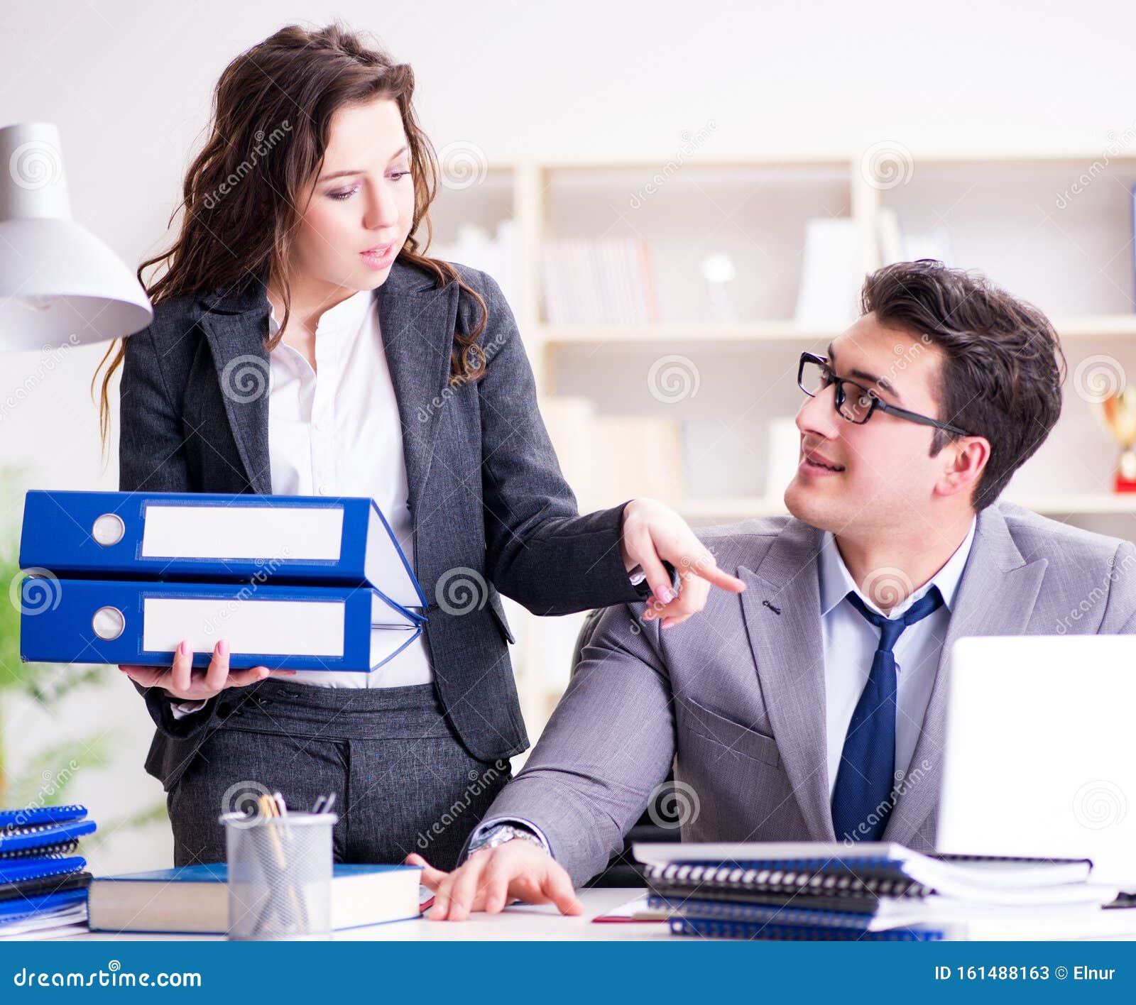 Businessman Asking for Paperwork from His Assistant Secretary Stock ...