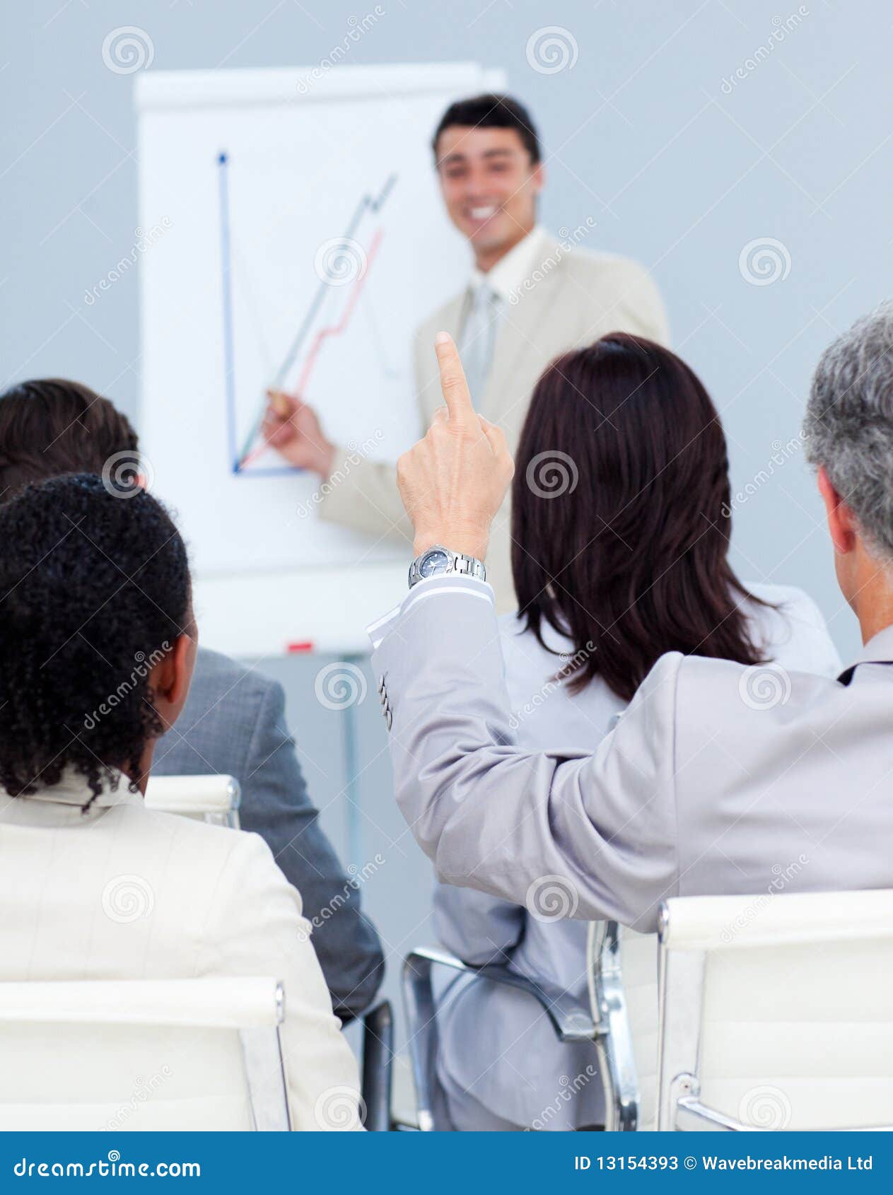 Businessman Asking a Question at a Presentation Stock Image - Image of ...