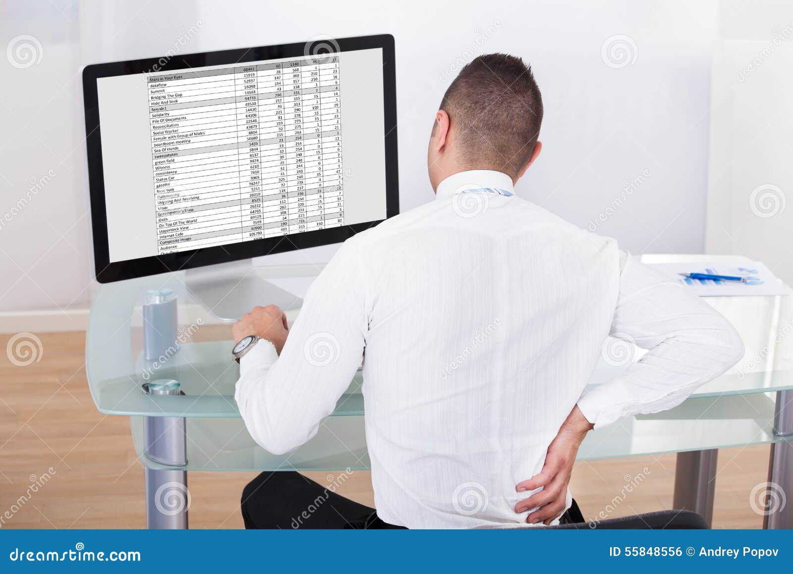 Businessman with Backache Using Computer at Desk Stock Photo - Image of ...