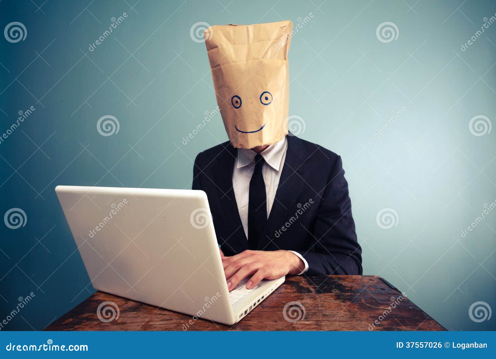 Businessman with Bag Over Head Working on Computer Stock Photo - Image ...