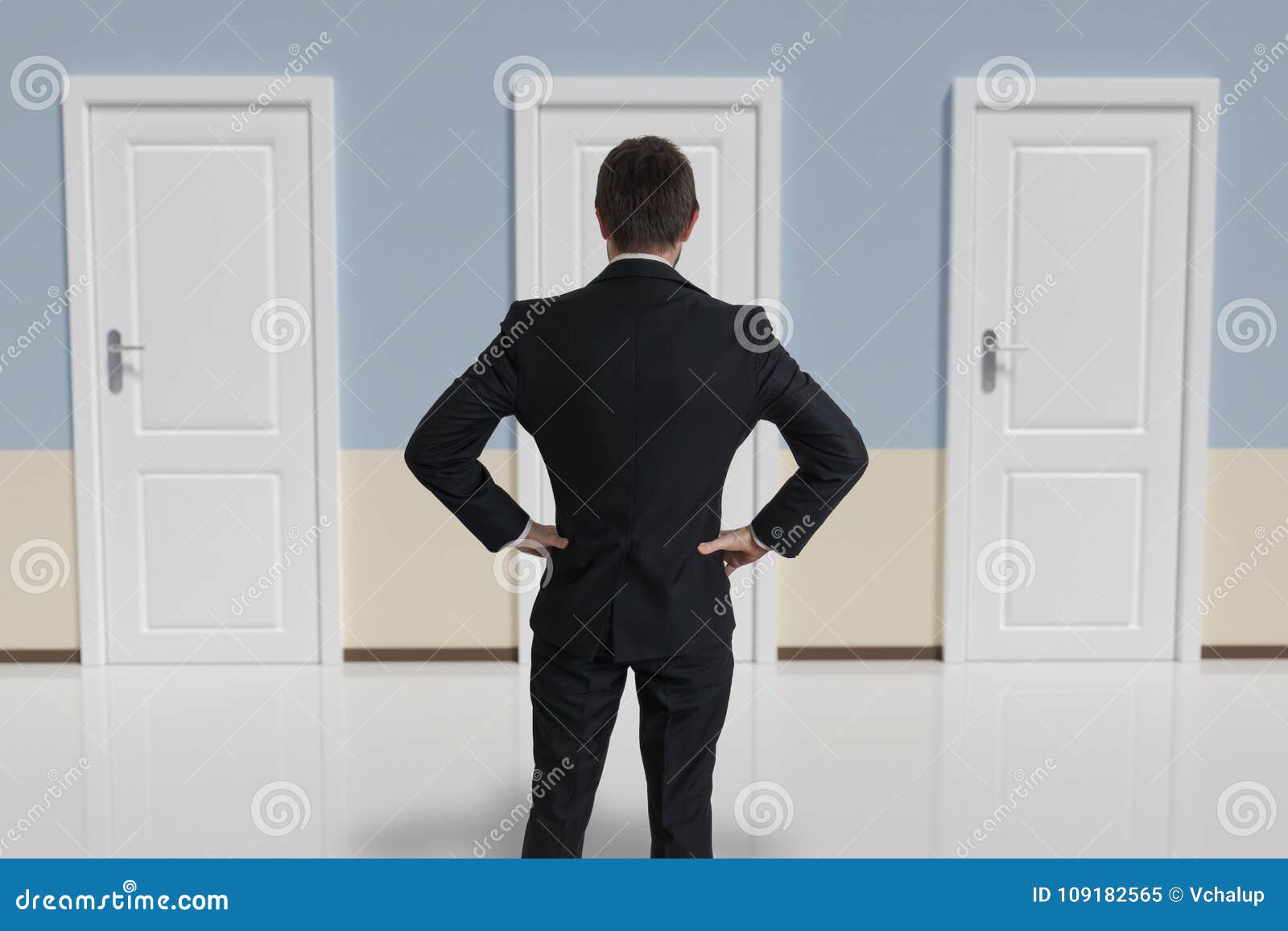 Businessman from Behind is Making Decision and Selecting the Door Stock ... Businessman from Behind is Making Decision and Selecting the Door Stock ...